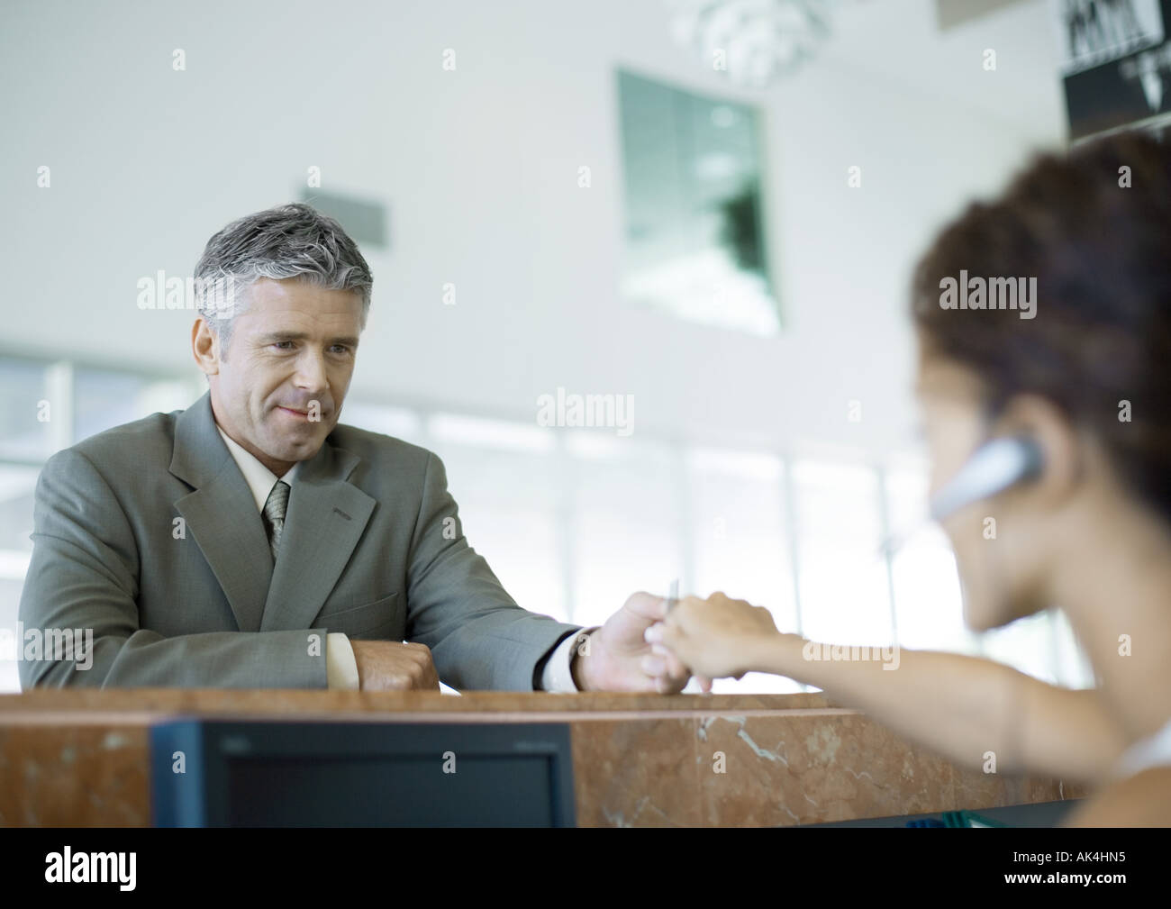 Handing something hi-res stock photography and images - Alamy