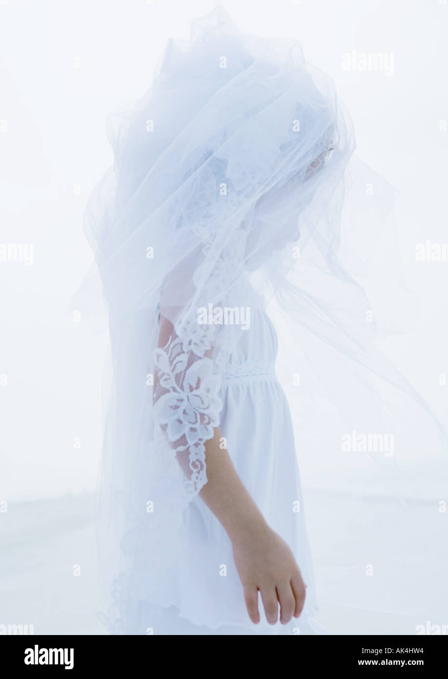 Little girl wearing bridal veil, side view Stock Photo - Alamy