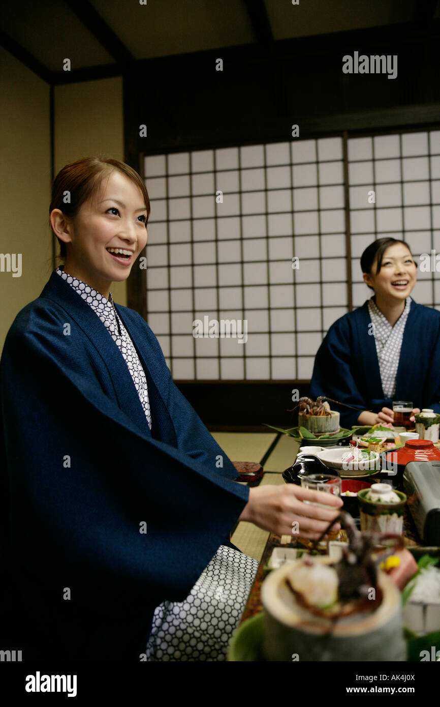 Two women having a feast Stock Photo - Alamy
