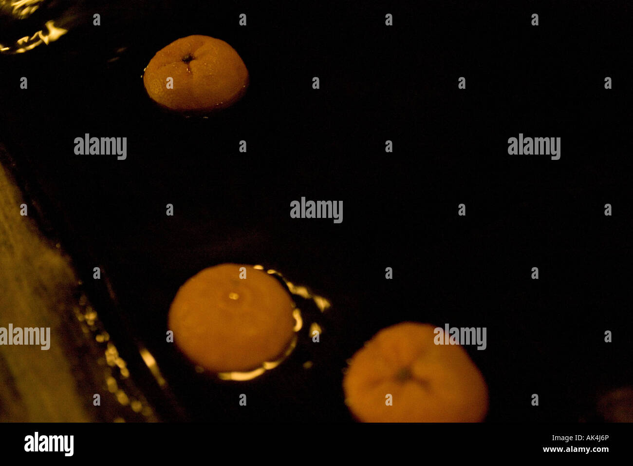 Oranges floating in water Stock Photo - Alamy