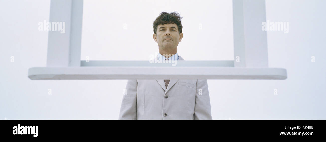 Business man hanging upside down hi-res stock photography and images ...