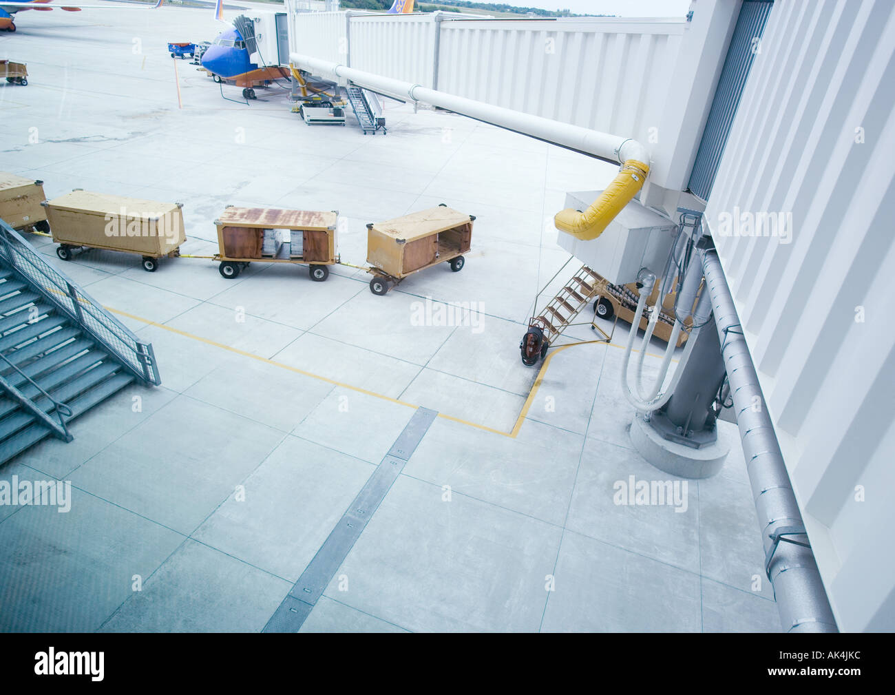 Luggage containers on airport tarmac Stock Photo - Alamy