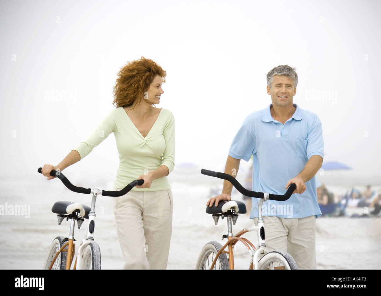 Two individuals walking at the beach hi-res stock photography and ...