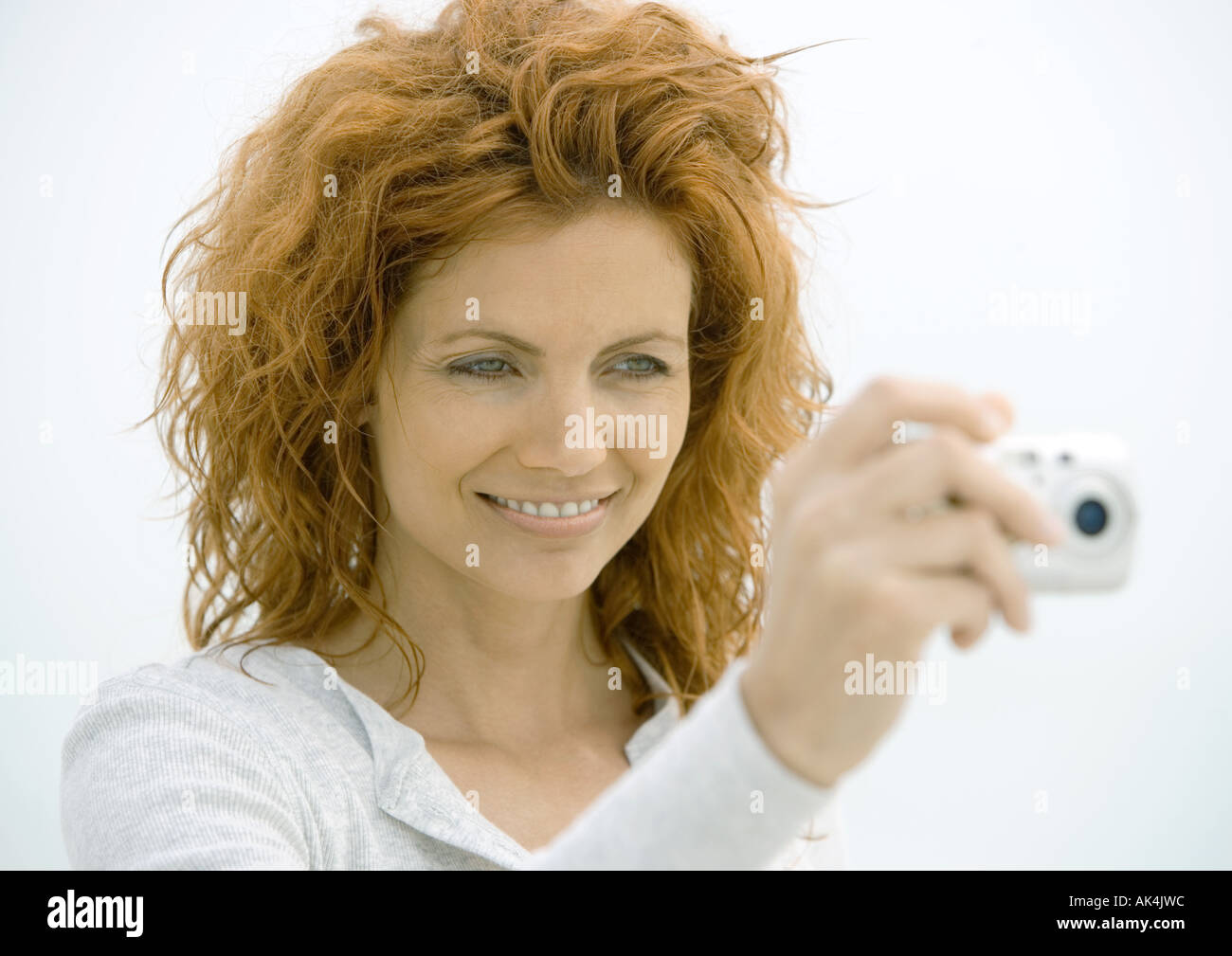 Woman taking photo with camera Stock Photo - Alamy