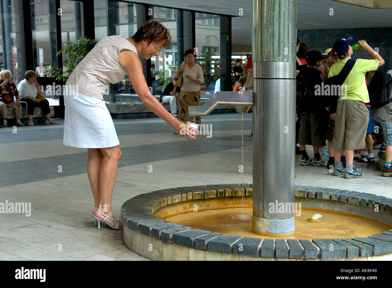 Fetching mineral water in the Hot Spring Colonnade Carlsbad Karlovy ...