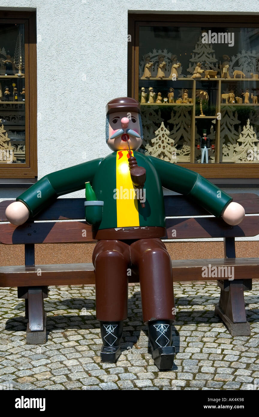 Sitzender giant Smoking Man Christmas village Seiffen Germany Stock ...