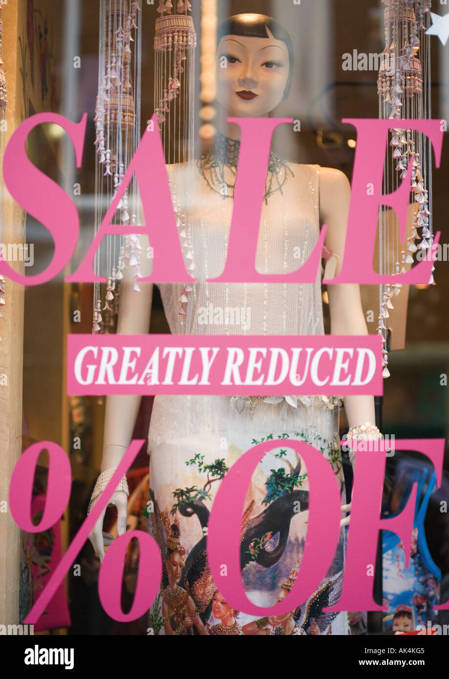 Sale sign in shop window Stock Photo - Alamy