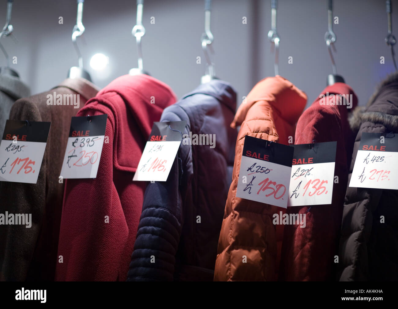 Coats hanging on a rack hi-res stock photography and images - Alamy