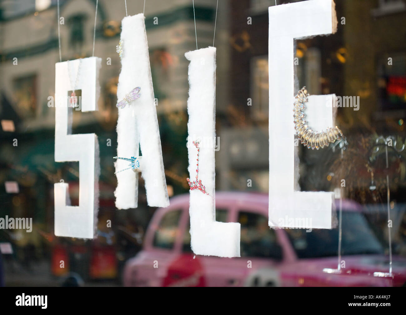 Sale sign in shop window Stock Photo - Alamy