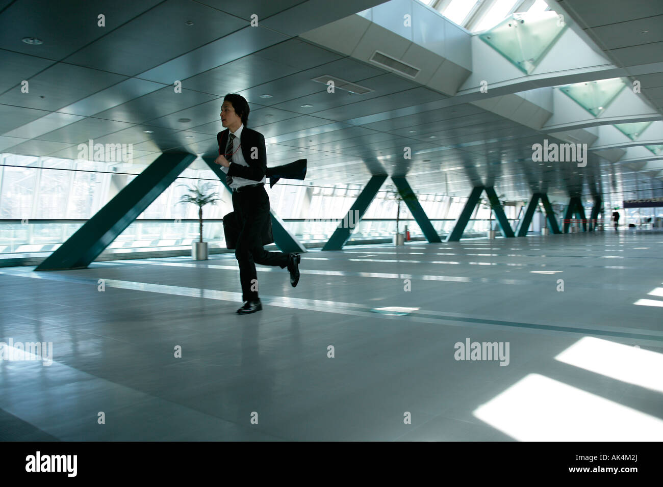 Man running in suit hi-res stock photography and images - Alamy