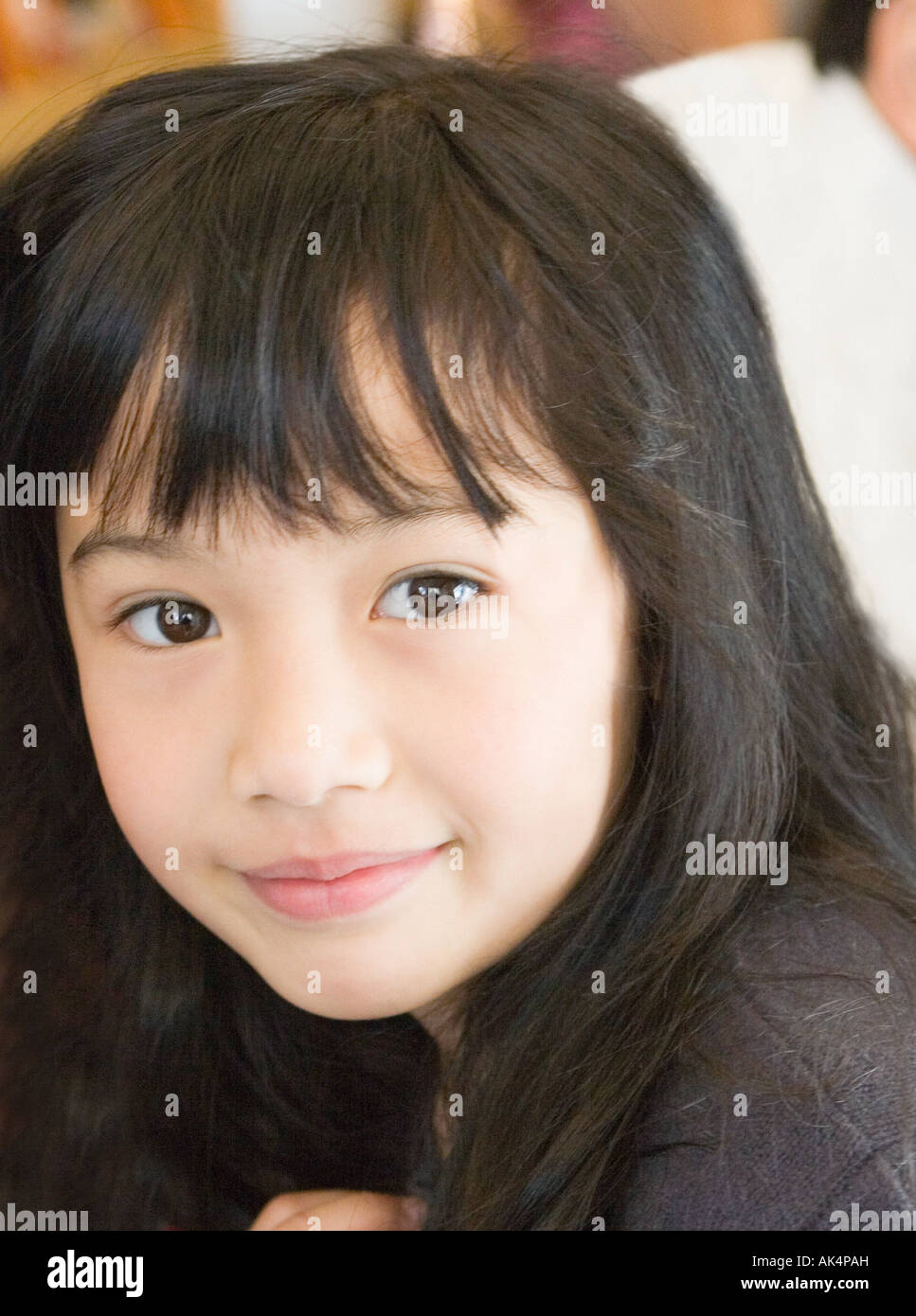 child Girl 5 7 indoors smiling portrait Stock Photo - Alamy