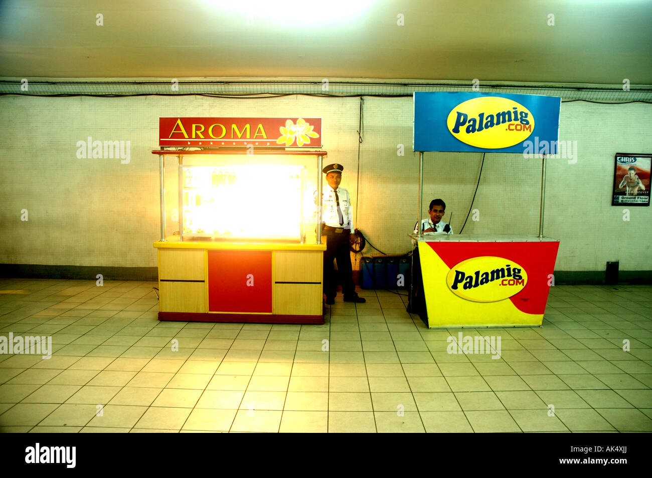 Two security guards underground at a fast food kiosk in Manila Stock ...