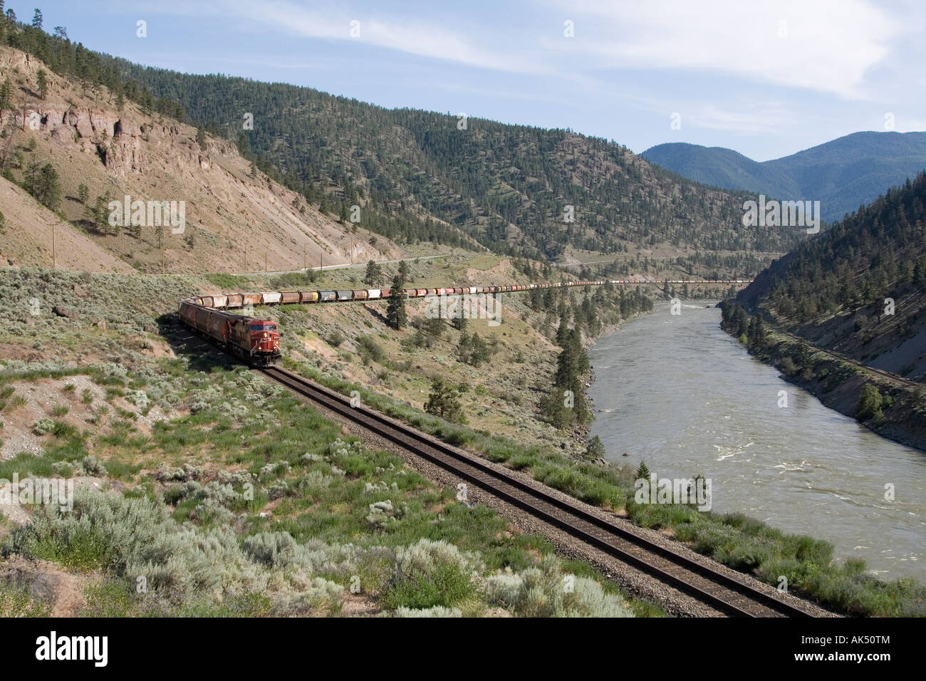 Canadian Pacific Locomotive hauls a freight train along the Fraser ...