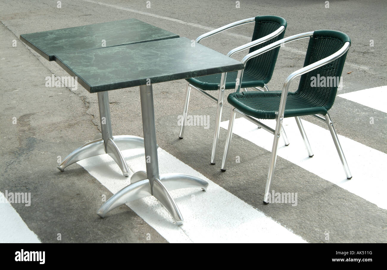 Table and chairs over a zebra crossing Stock Photo - Alamy