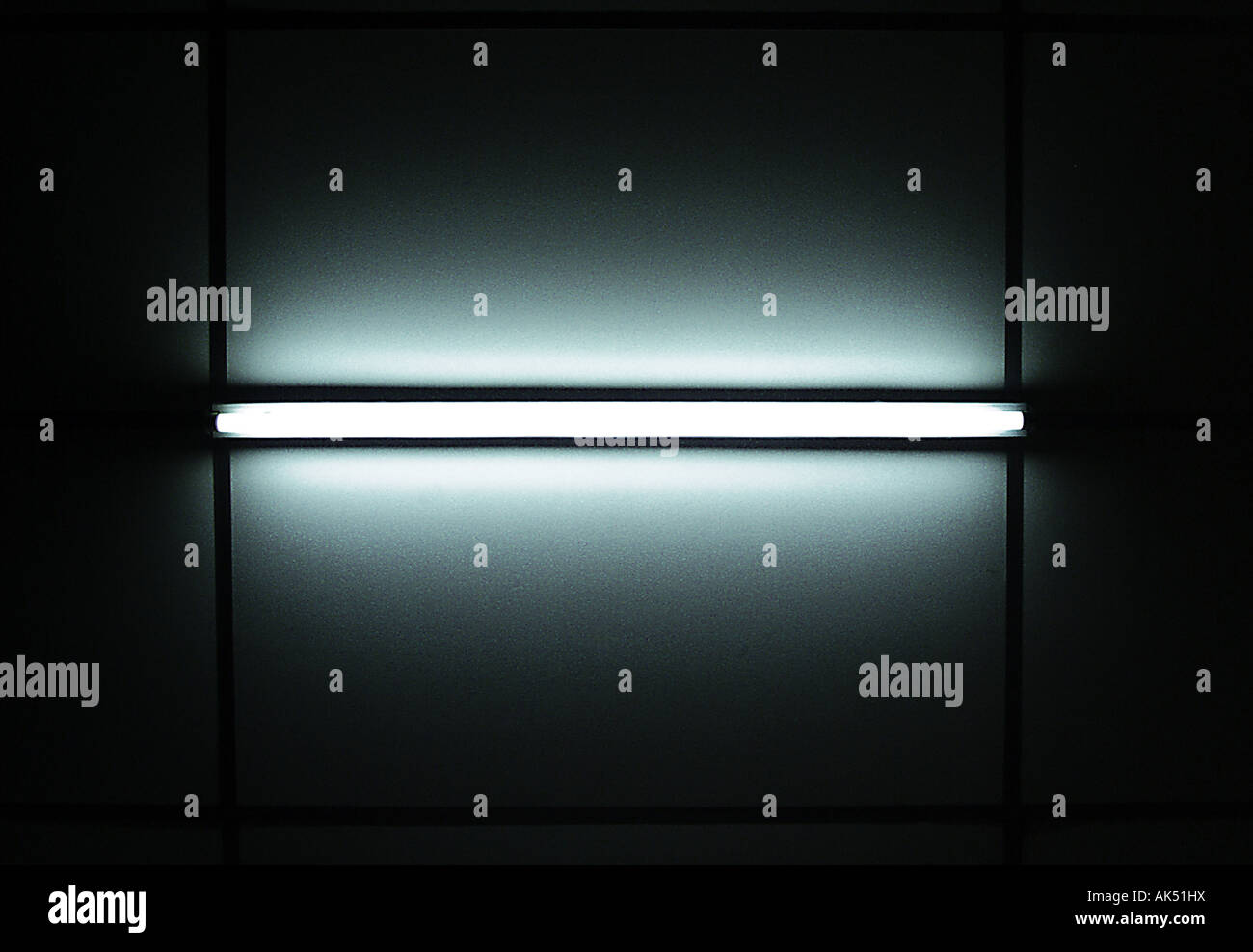 A fluorescent bulb fitting on a ceiling Stock Photo - Alamy