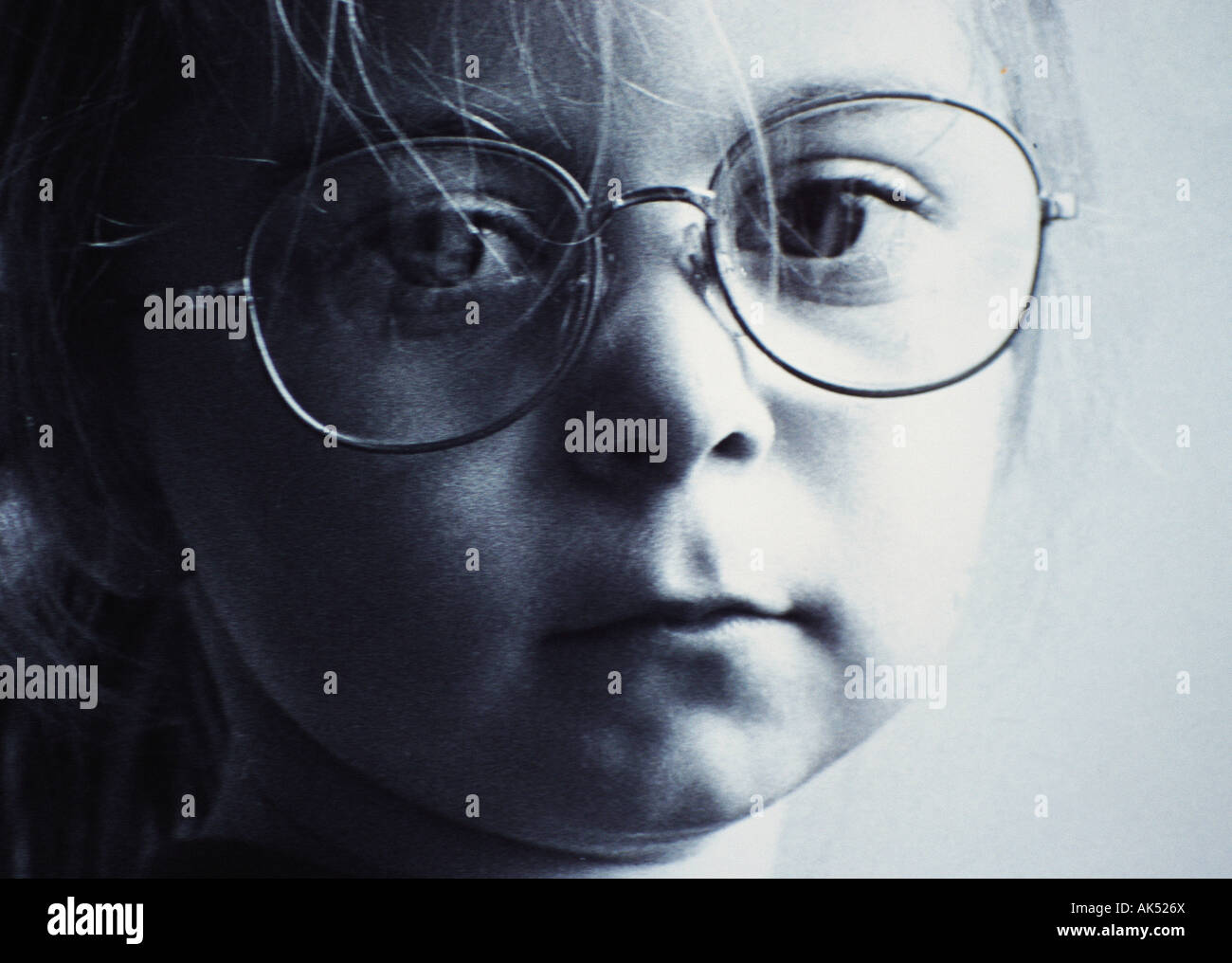 Close up portrait of little girl's face wearing spectacles Stock Photo ...