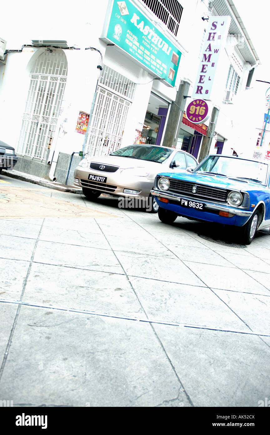 Two cars on a street in Georgetown, Malaysia Stock Photo - Alamy