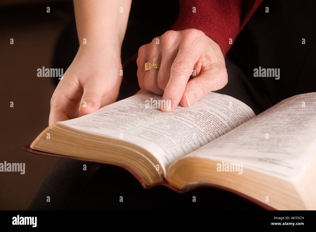 Two people reading the Bible Stock Photo - Alamy