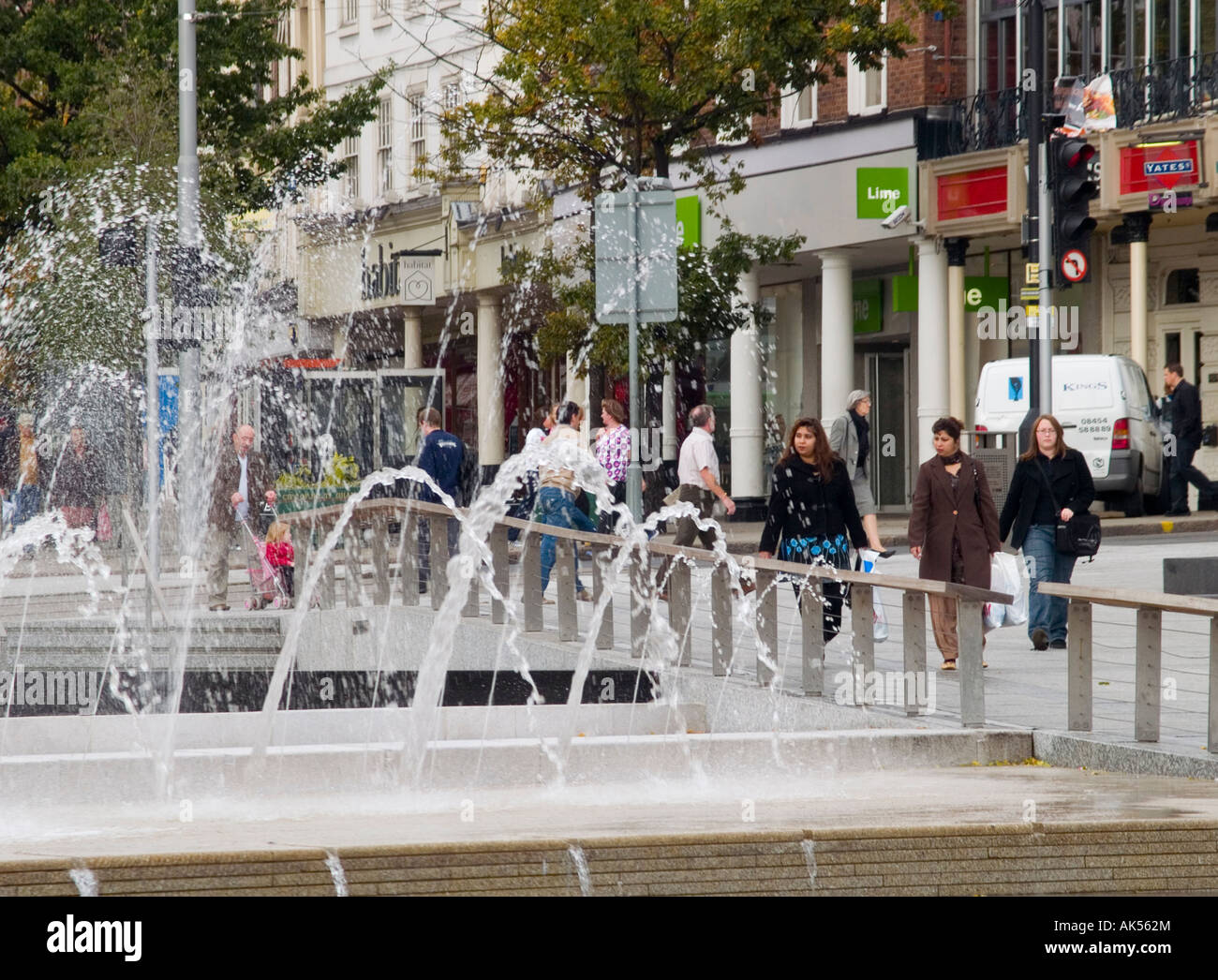 People walking past the fountains in the new Market Square, Nottingham ...