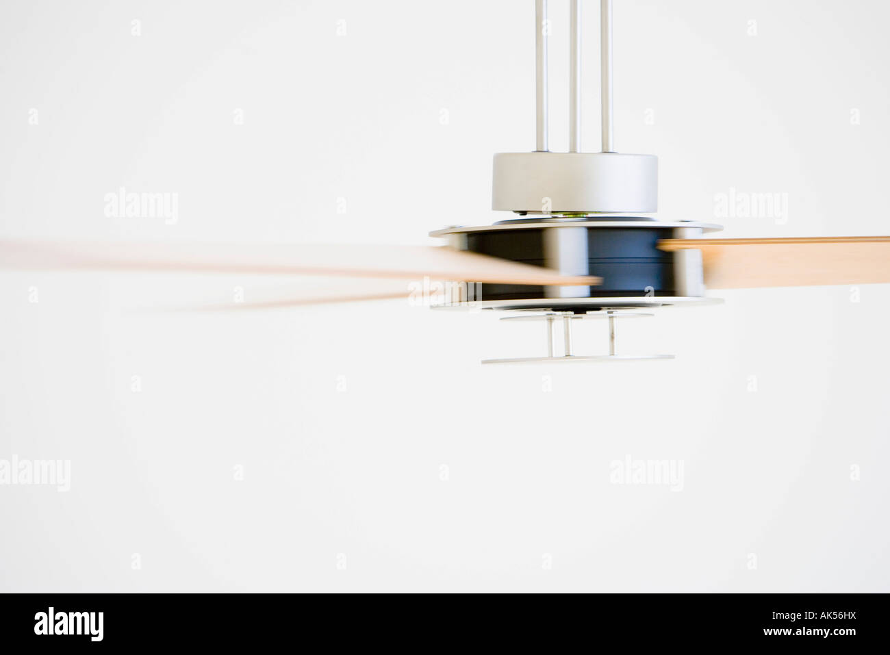 Modern Ceiling Fan in Motion Stock Photo - Alamy