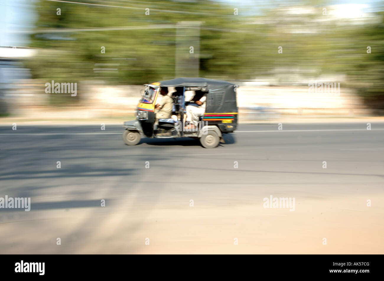 A fast moving rickshaw racing around the streets of Jaipur Stock Photo ...
