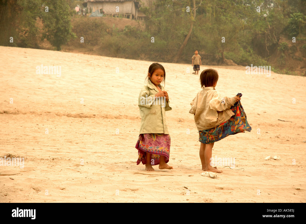 Two local children on the river bank of the mekong in Laos Stock Photo ...