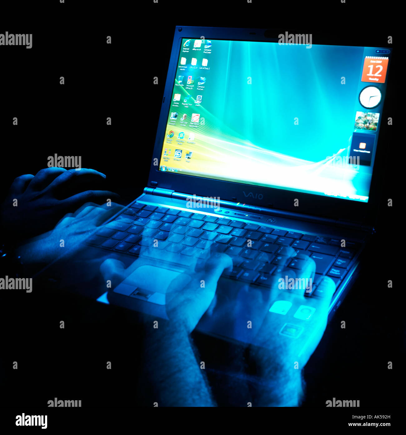 hands moving over a laptop Stock Photo - Alamy