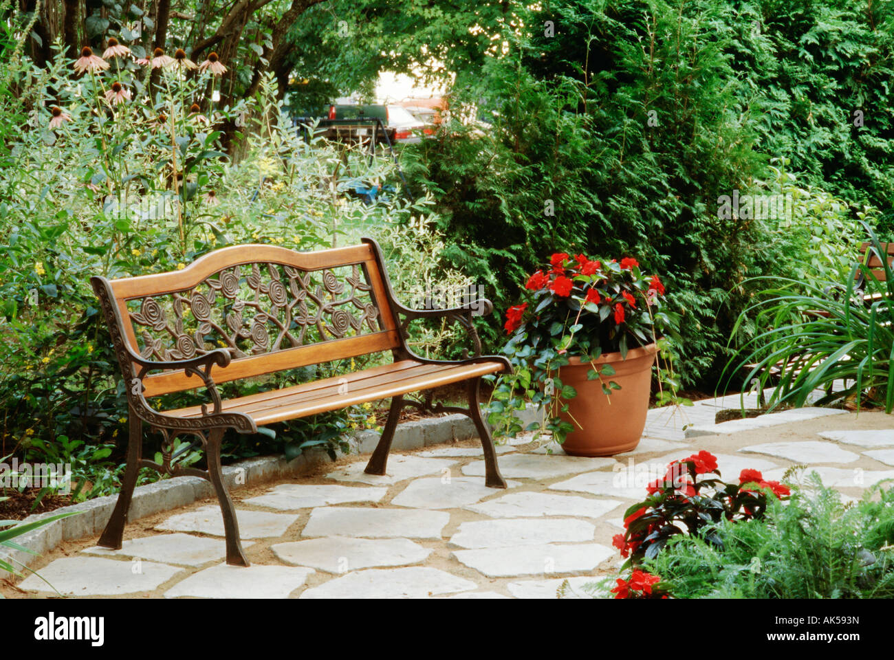 Bench in a garden setting Stock Photo - Alamy