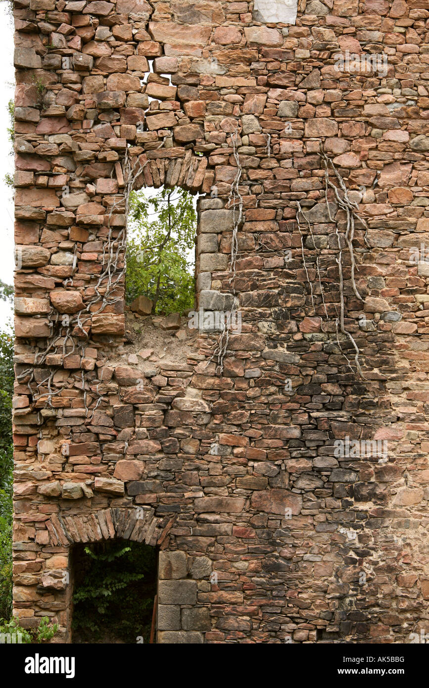 Crumbling stone wall with arched window Stock Photo - Alamy