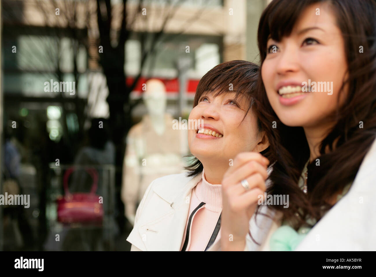 Two women window shopping, close-up Stock Photo - Alamy