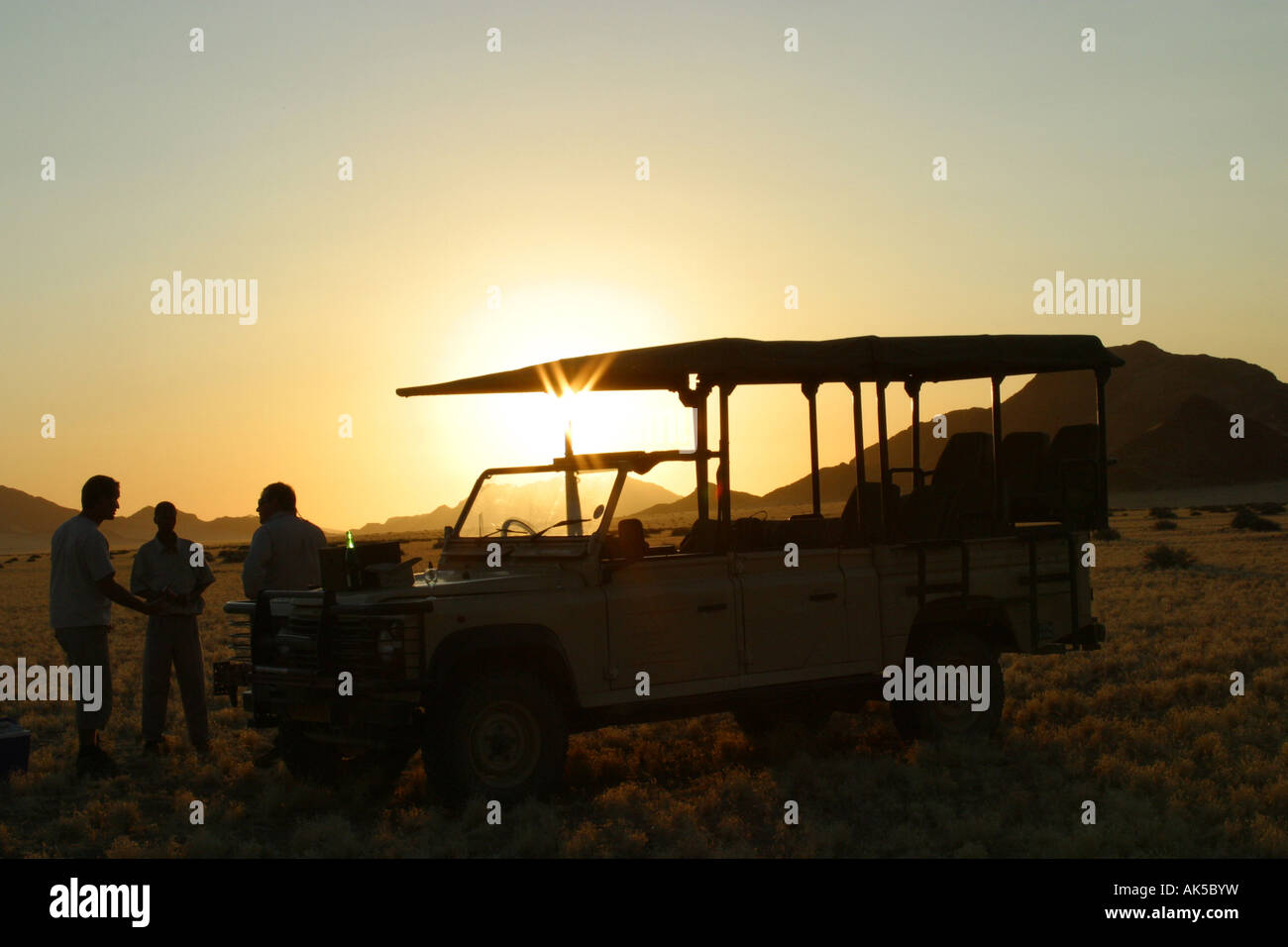 Enjoying a sundowner at sunset in the Namibian Namib Desert Stock Photo ...