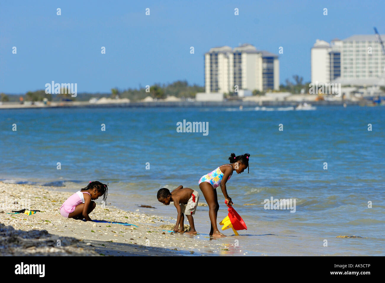 Children playing at beach Stock Photo - Alamy