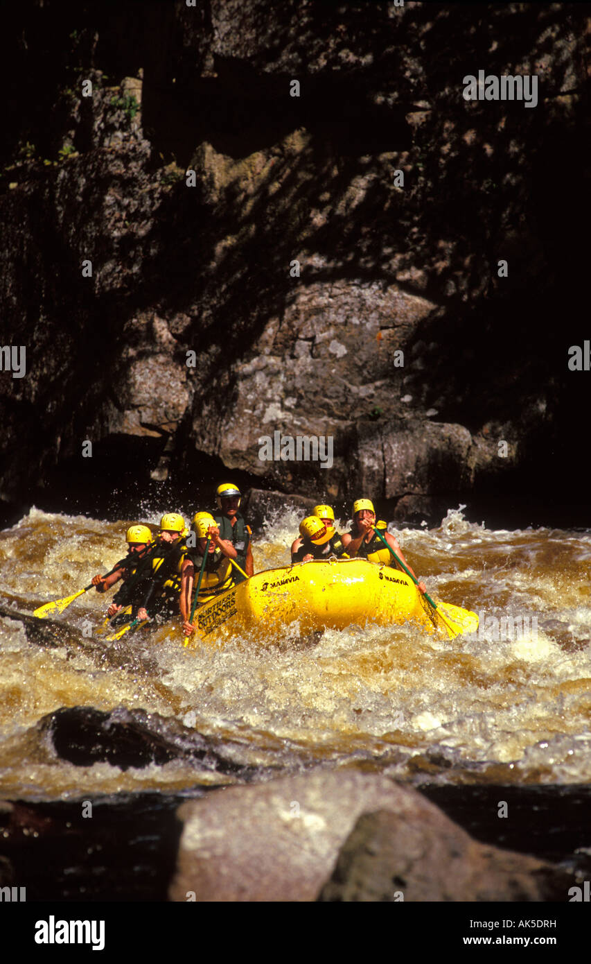 Group of people on a raft negociating the white water of the Ripogenus ...