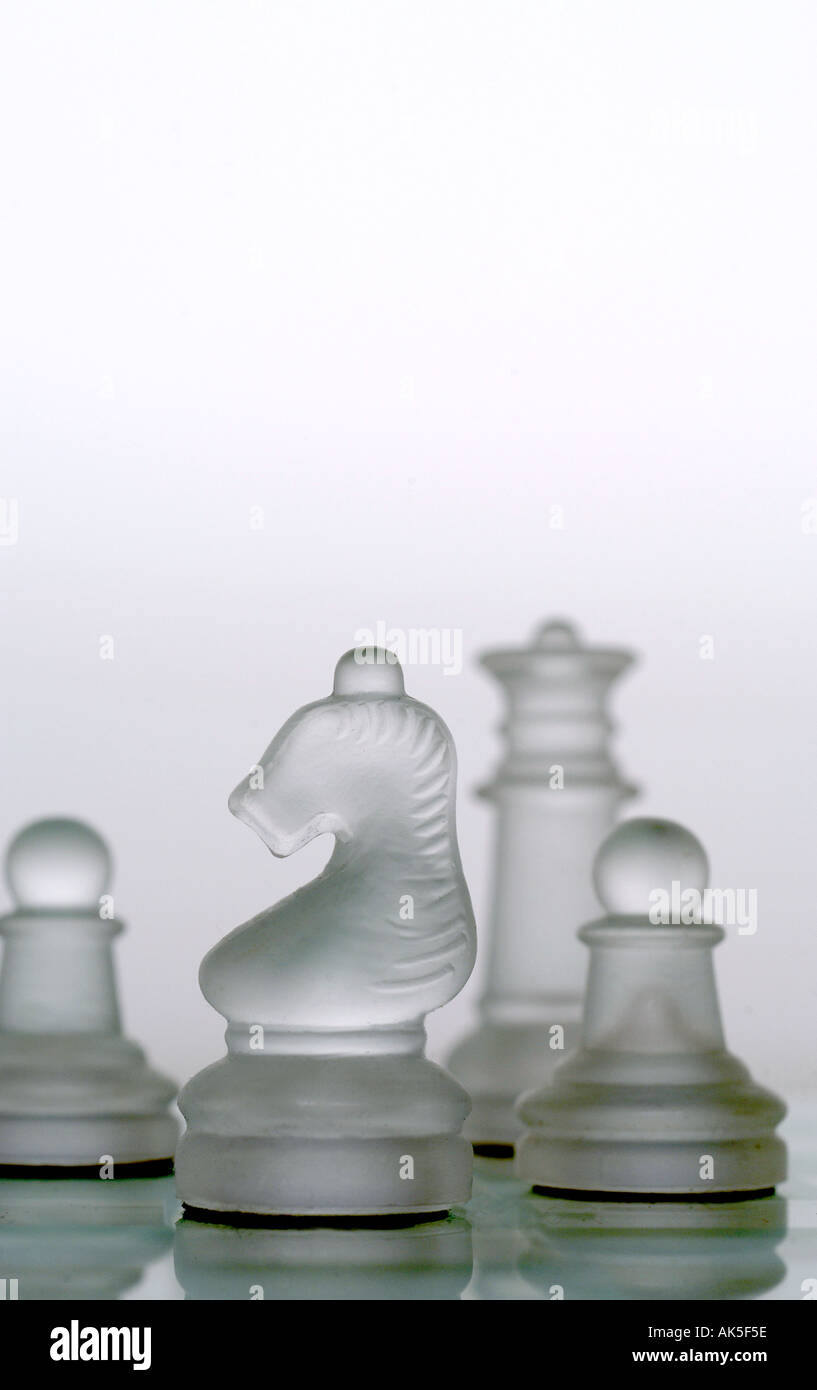 Vertical color image of glass chess pieces on a chess board Stock Photo ...