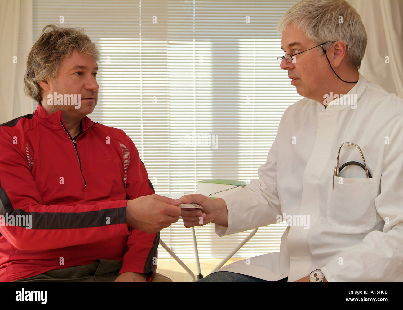 man with the doctor Stock Photo - Alamy