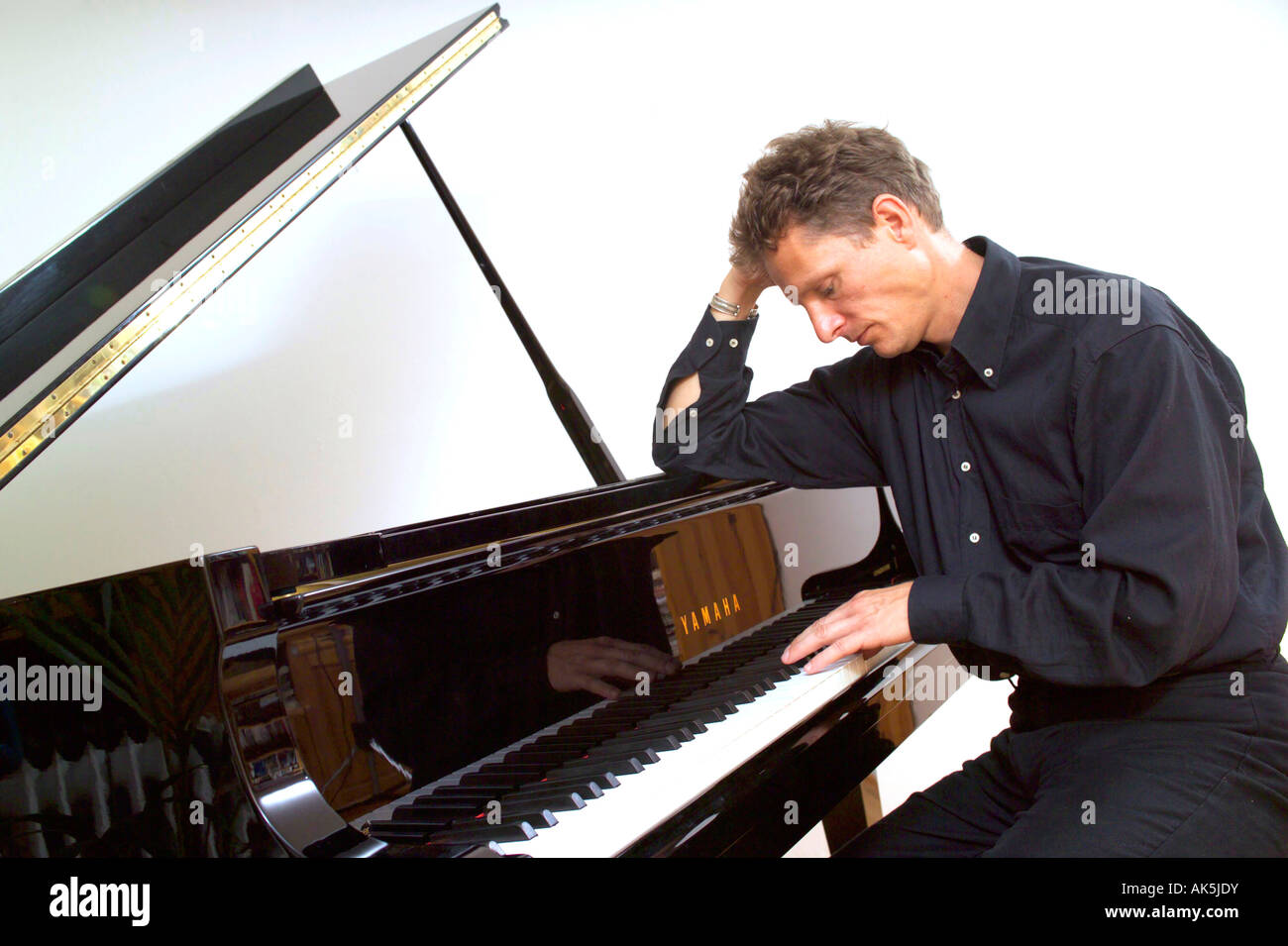 Man playing piano Stock Photo - Alamy
