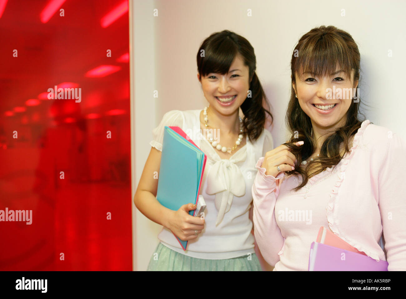 Two women standing in conference room Stock Photo - Alamy