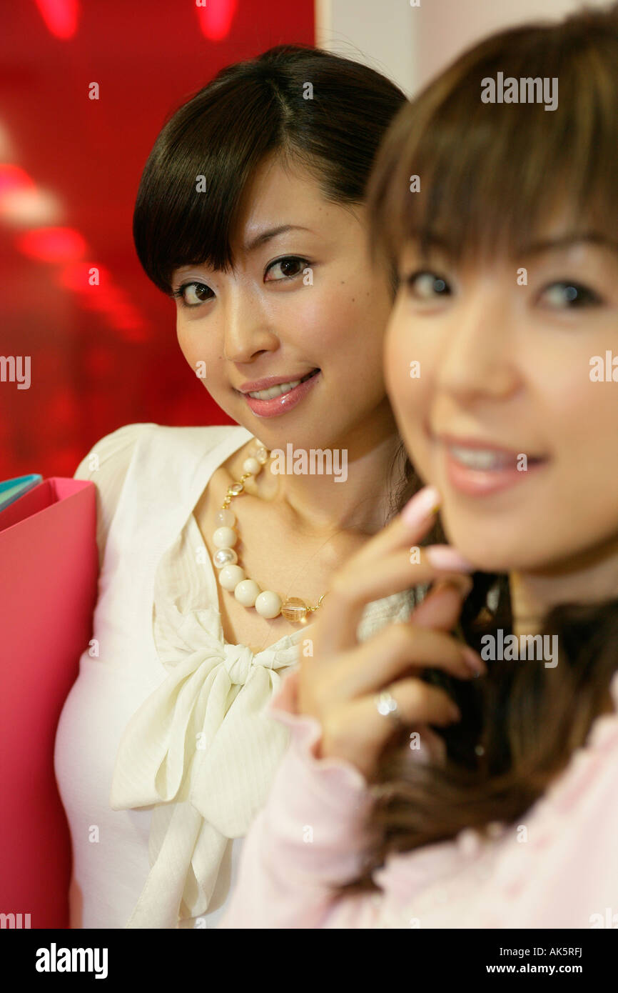 Two women standing in conference room, close-up Stock Photo - Alamy