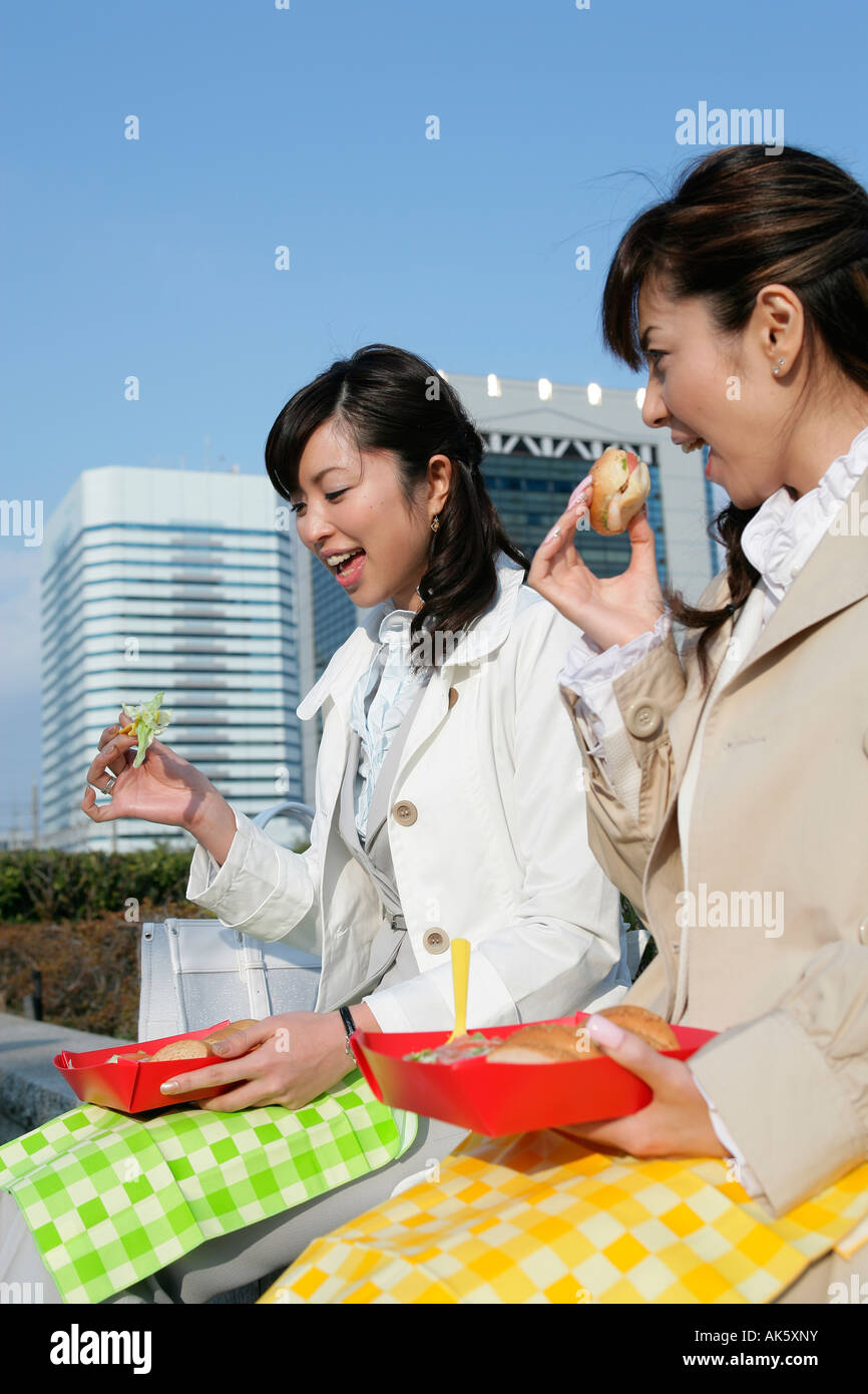 Two female office workers having lunch Stock Photo - Alamy