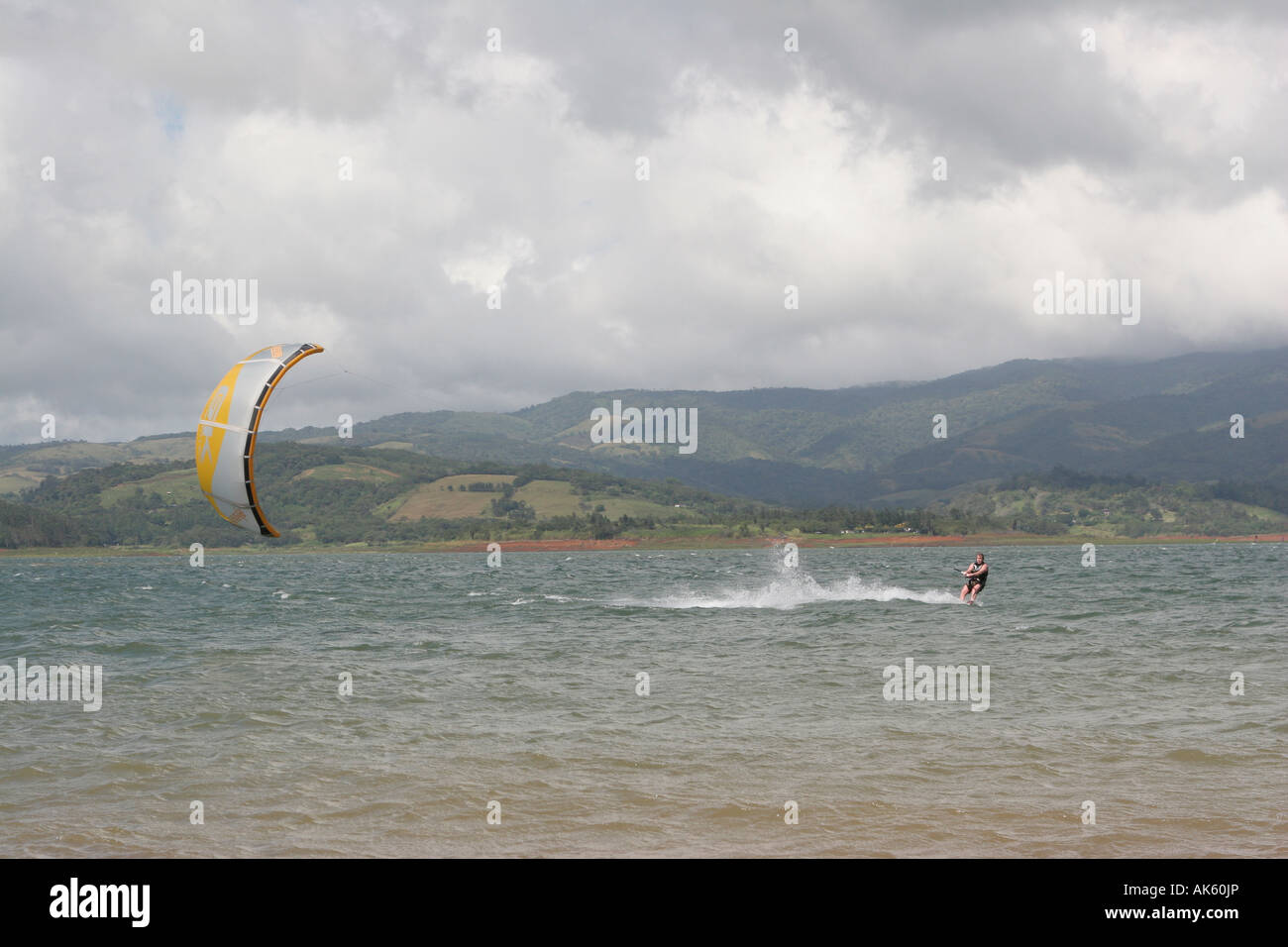 kite boarding in costa rica lake arenal Stock Photo - Alamy