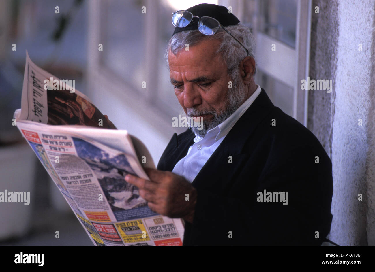 Jewish man reading the newspaper, Tel Aviv, Israel Stock Photo - Alamy