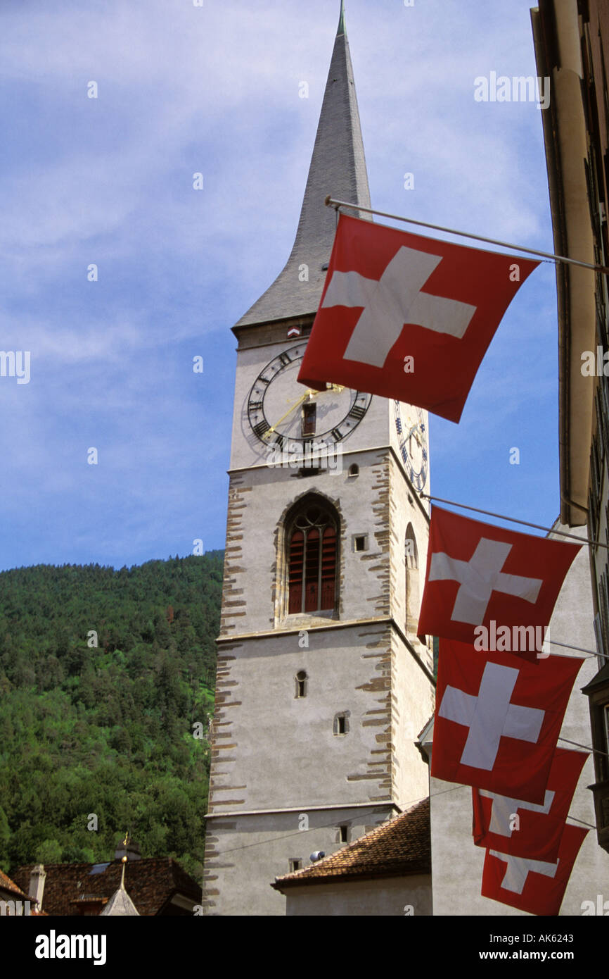Switzerland, Chur, Flags of Graubunden and Kirche St Martin Stock Photo ...