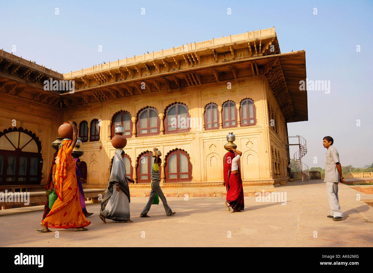 Water jugs on head hi-res stock photography and images - Alamy
