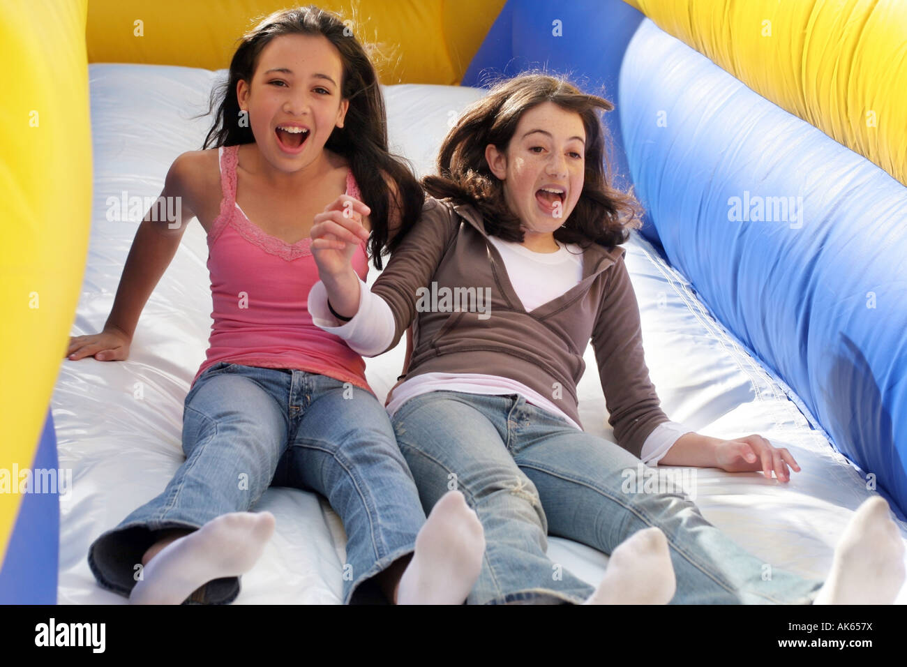 Girls on the slide Stock Photo - Alamy