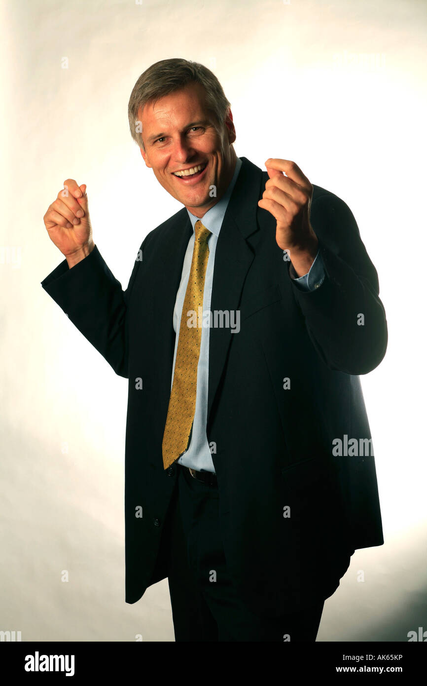 A smiling happy looking guy in a suit Stock Photo - Alamy
