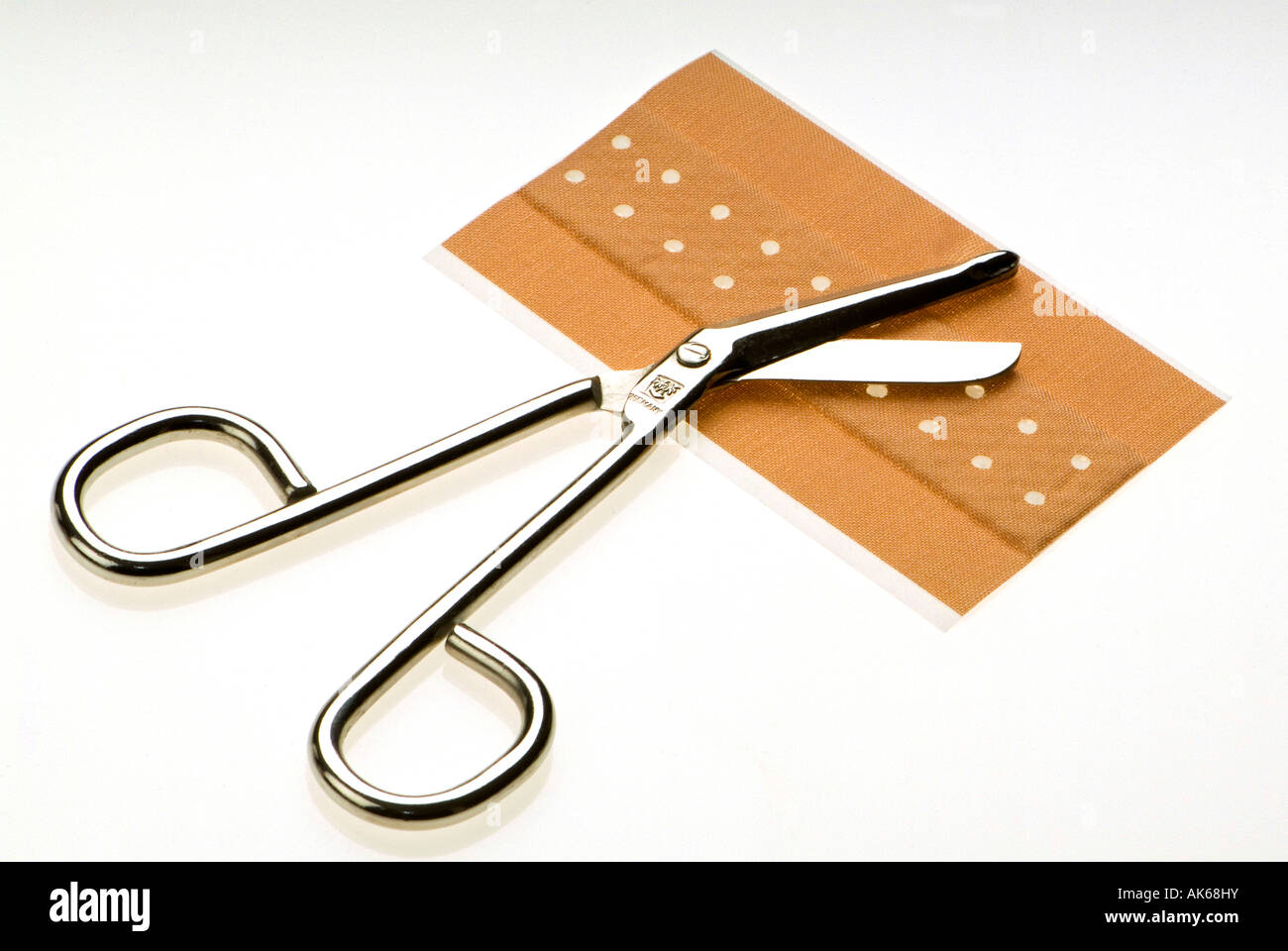Medical strip and scissors Stock Photo - Alamy