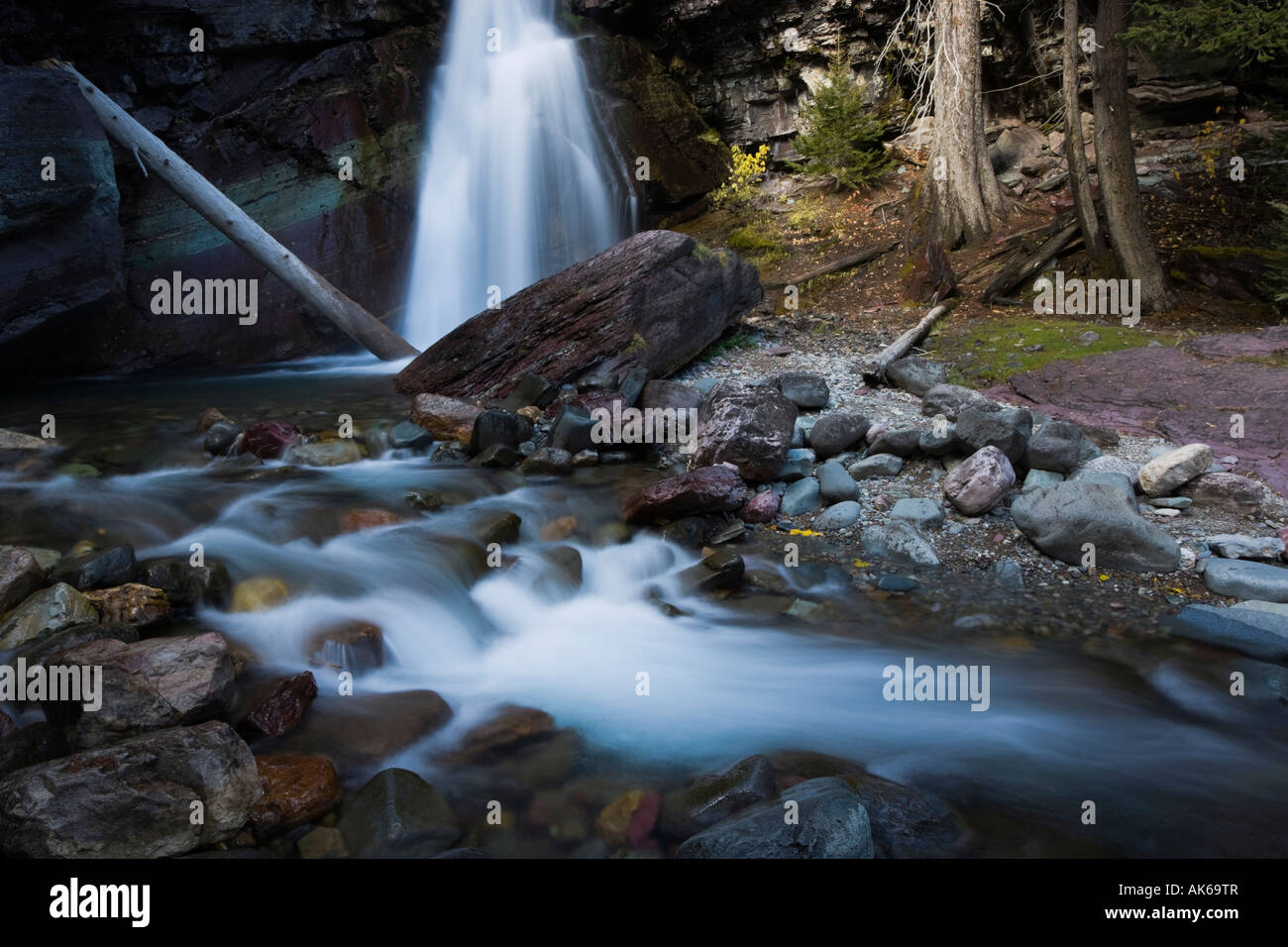 Flowing water of Baring Falls in Glacier National Park, Montana, USA ...