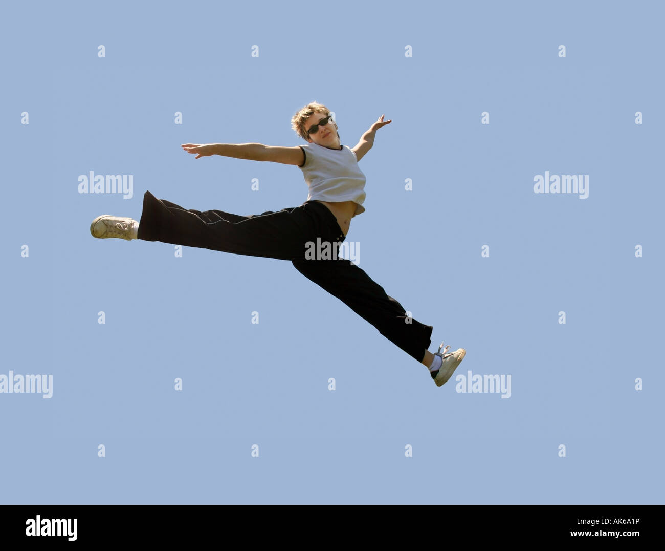 Young woman jumping high Stock Photo - Alamy