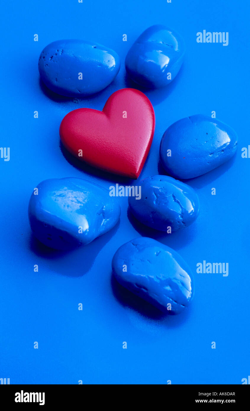 Red heart and blue stone Stock Photo - Alamy