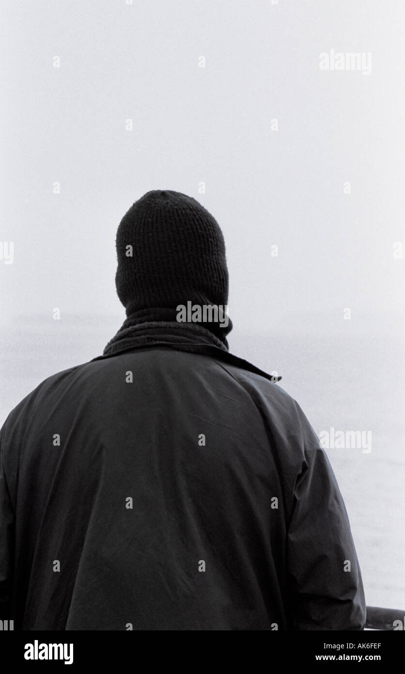 Back of Man with Coat and Balaclava Stock Photo - Alamy